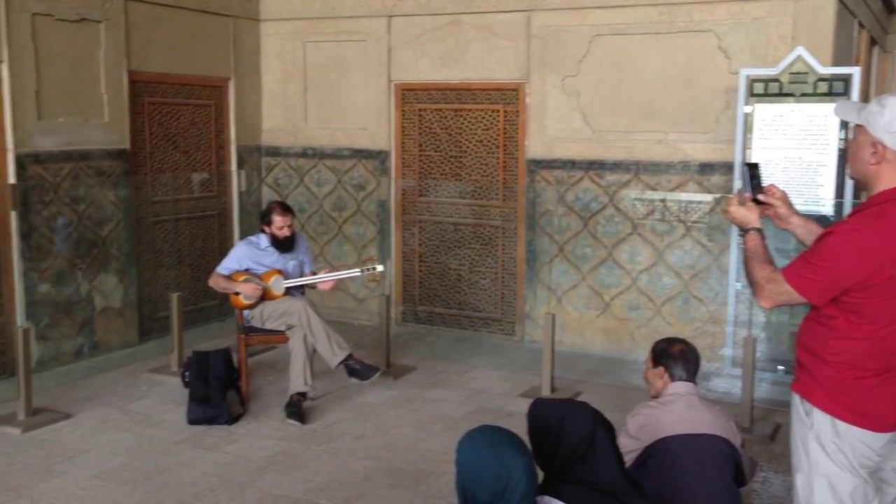 Esfahan. Chehel Sotoun Palace. Man playing on tar.