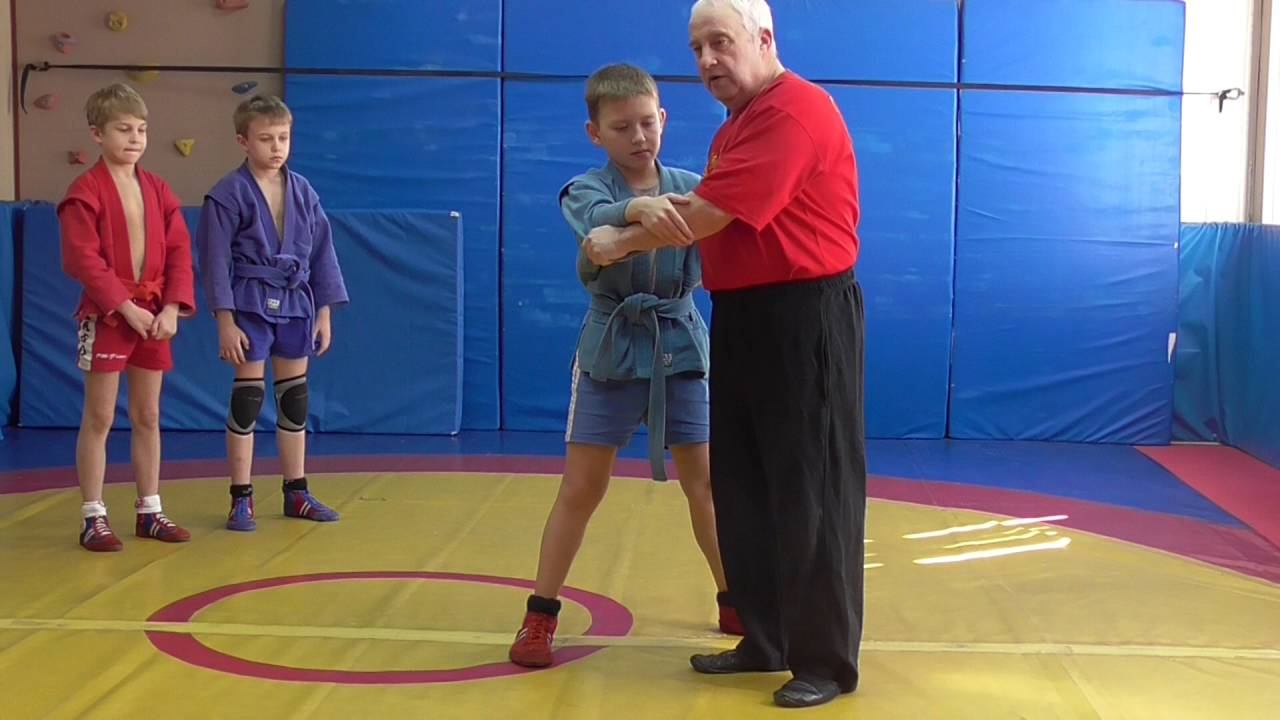 Бросок через бедро с захтом пояса сзади