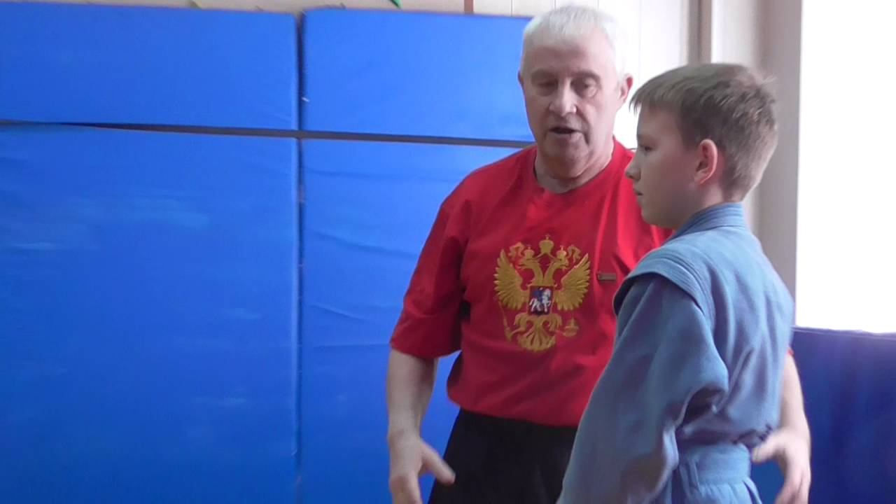 Бросок через спину с захватом двух рук с падением