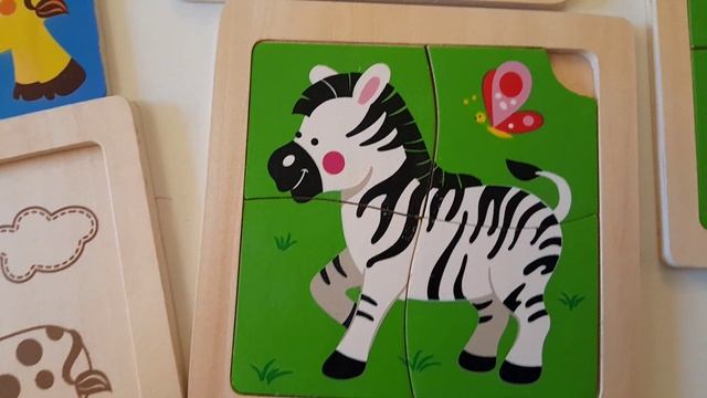 Пособия 1: пазлы и башня-пирамидка.