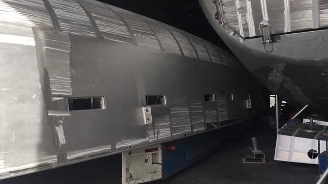 Preparing the hull of 66ft Qilak for the turning over