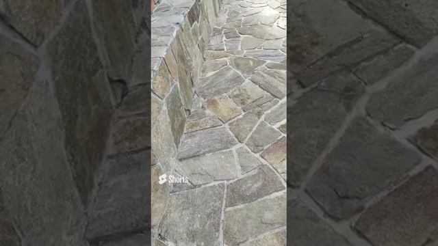 Облицовка цоколя дома и отмостки уральским златолитом.