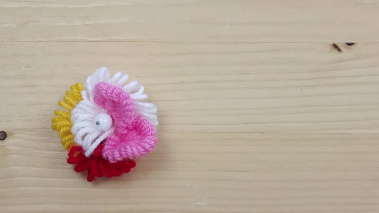 Видеоурок цветы из пряжи с помощью вилки