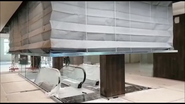 Противопожарная EI60 штора "Гармошка" МВА отсекающая эскалатор  при пожаре в бизнес-центре.