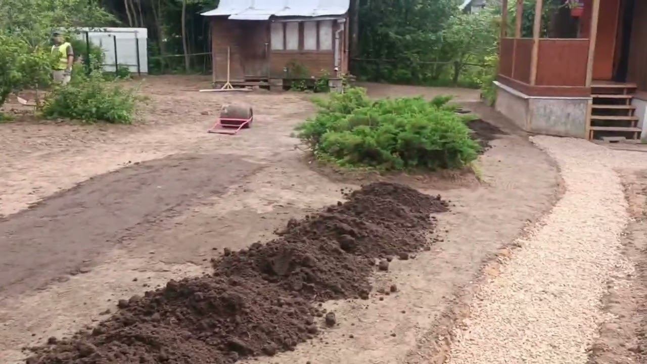 Планировка участка техникой, отсыпка плодородного грунта, внесение удобрений, посев семян.