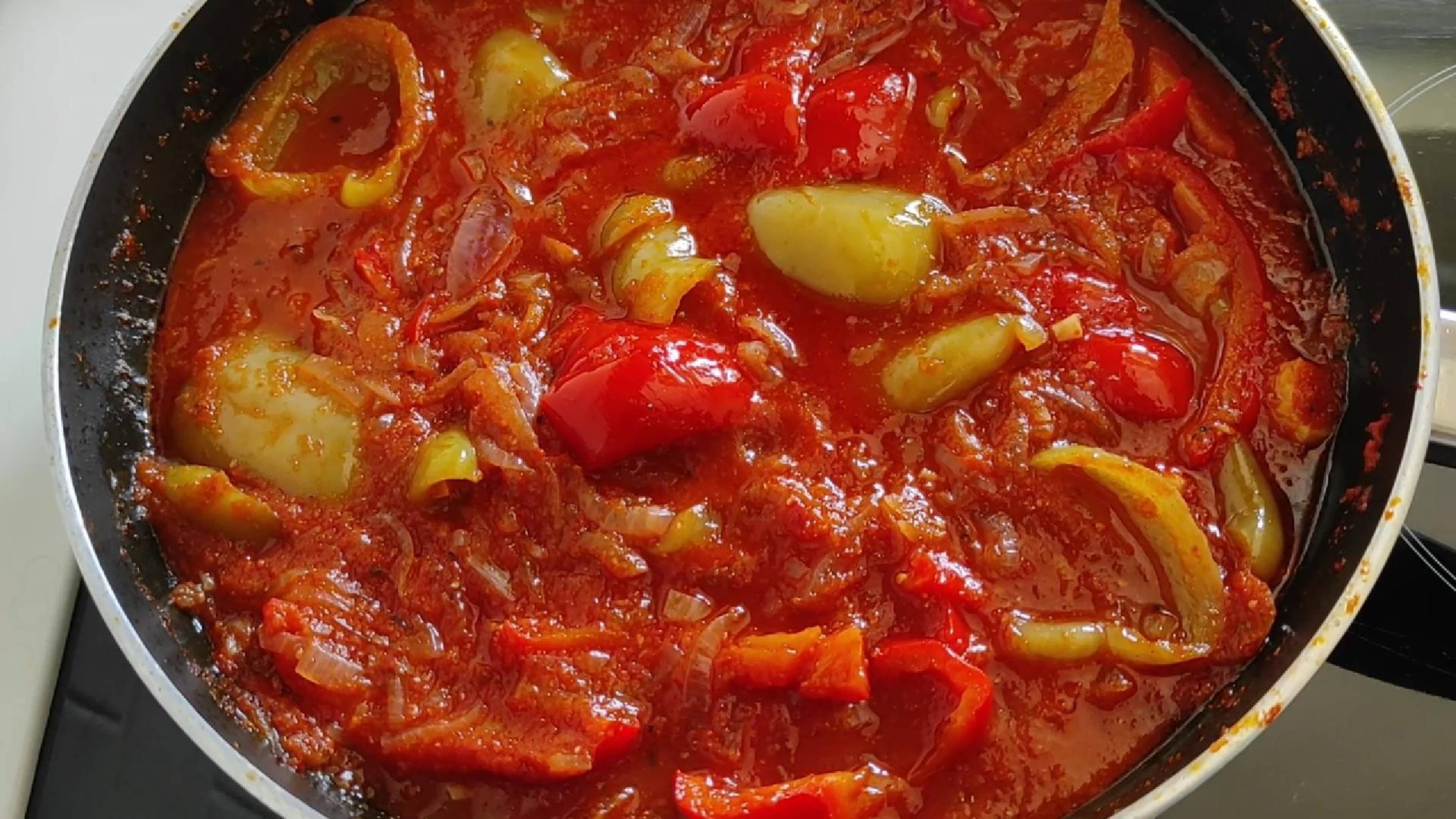 Enjoyed to the last spoonful - An appetizer of bell peppers, onions and tomatoes!