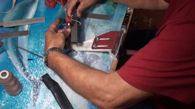 Заточка убиенного наждаком ножа.......