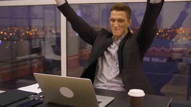 Young business man in evening office.