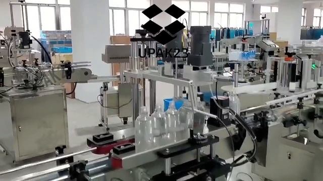 Автоматическая линия розлива, укупорки и этикетировки с накопительным и подающим столами.