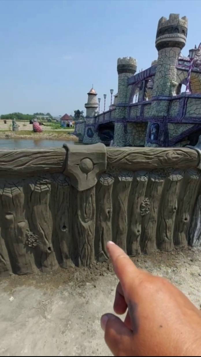 беседка  в  парке из арт бетона в виде бревна.