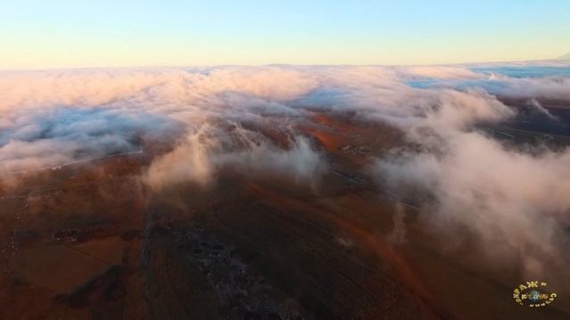 Вечерний полет над облаками. Река Уруп. Гора Эльбрус.