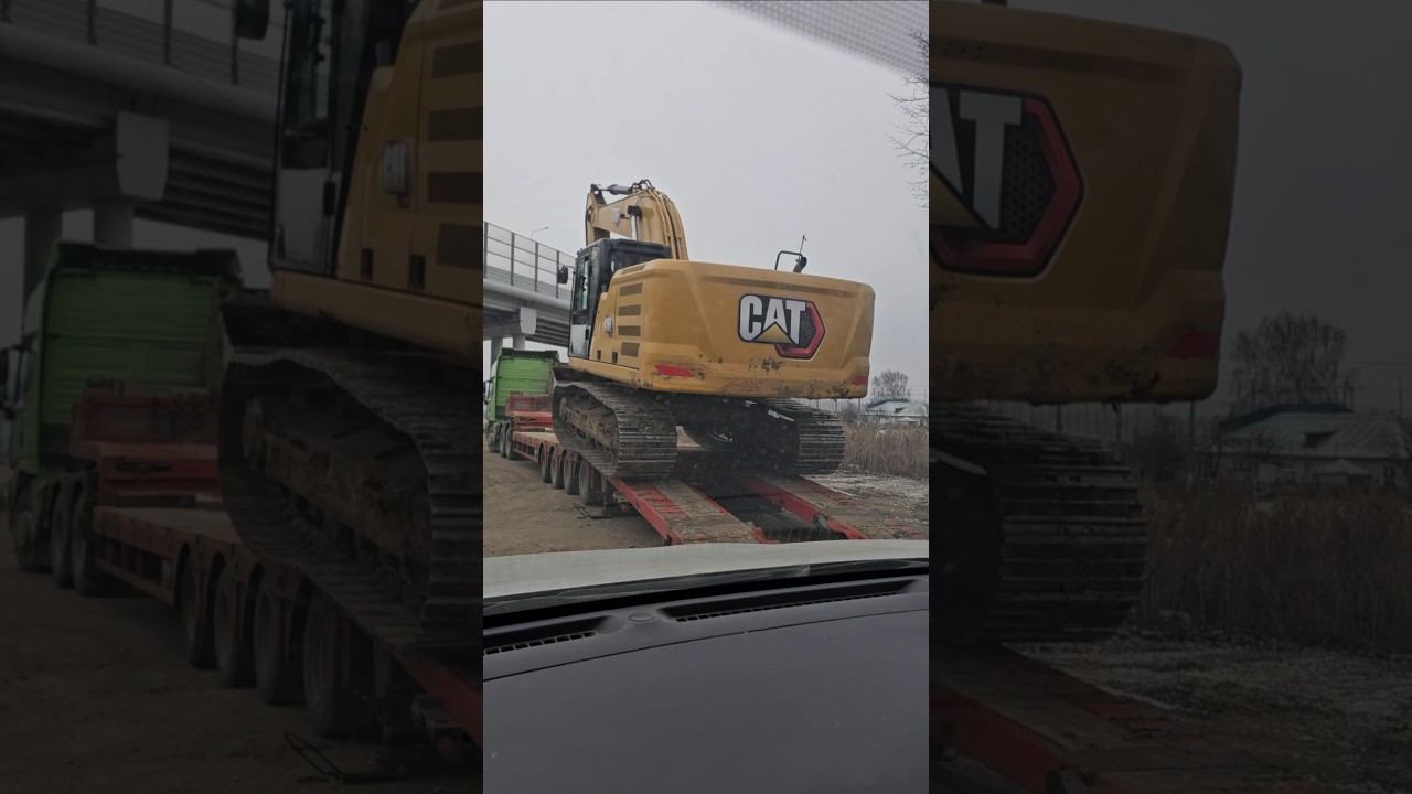 Грузят экскаватор, чуть не упал