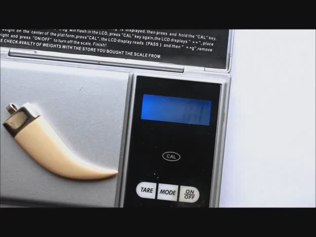 Подвеска из благородной кости - клык из бивня мамонта в оправ