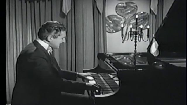 Liberace playing I'm Looking Over a Four Leaf Clover (1)