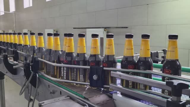 Линия усадки слив-этикетки на ПЭТ бутылки и их групповой упаковки в термоусадочную пленку. ДЭНКАР.