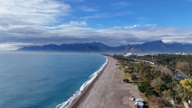 Antalya Beach Park - coastline, blue water, and mountains beyond the city