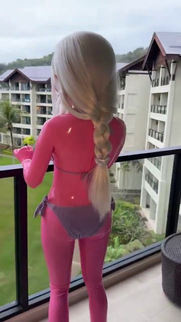 Pink Latex Kigurumi Doll in swimsuit.