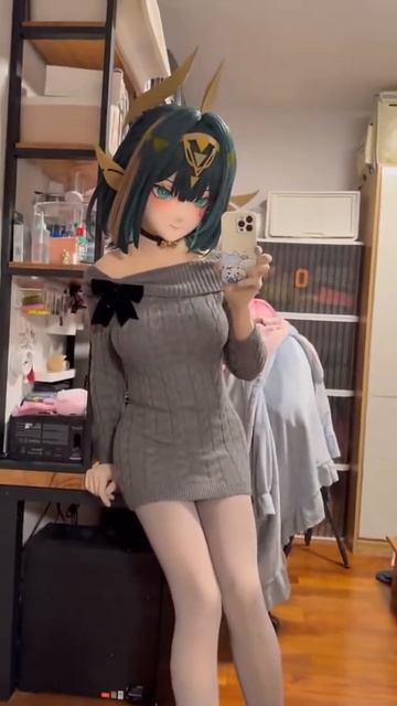 Nefer Kigurumi Doll in sweater dress.