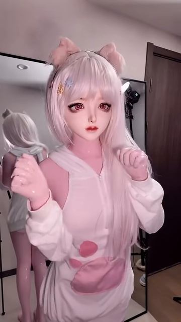 Kigurumi Doll is doing "Kiss-kiss" hand gesture dance.
