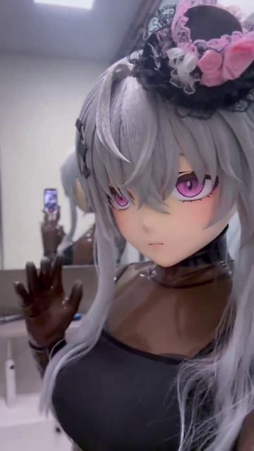 Latex Kigurumi Doll make selfie in her bathroom.