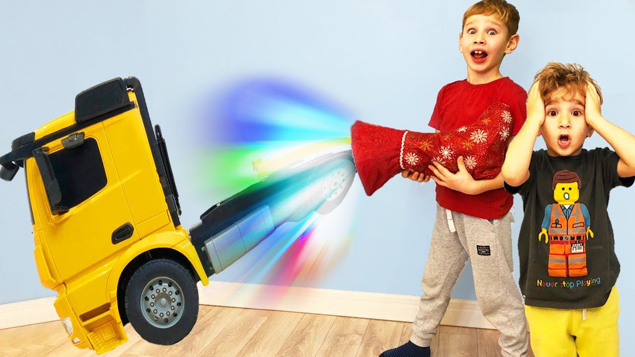 Lev and Gleb take Power wheels Trucks from Santa's boots Ride on and play with them #2