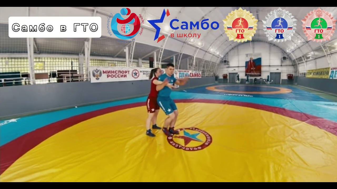 Самозащита. Действия ассистента: выполняет обхват туловища с руками сзади.