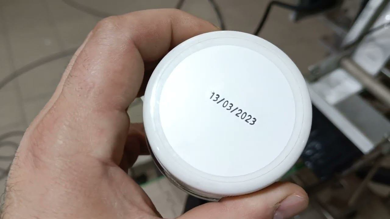 Нанесение этикетки на верх тары -  EtiKon.ru