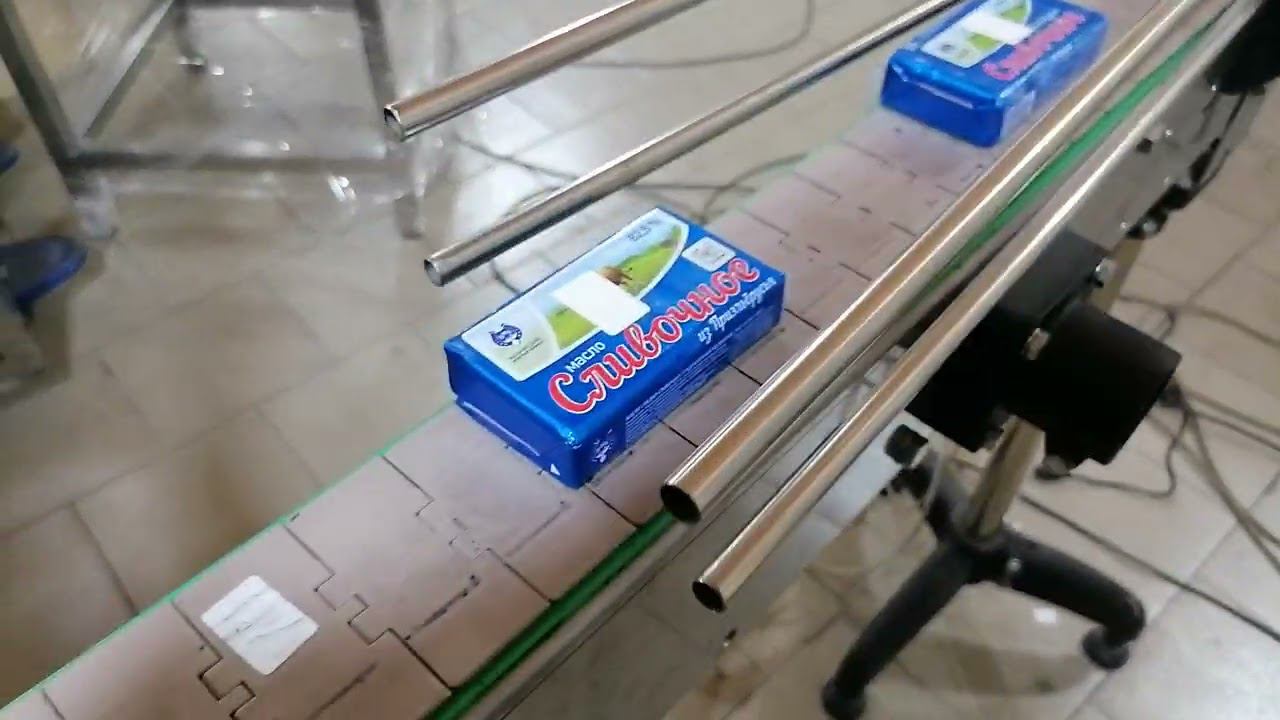 Нанесение этикетки на пачку с маслом  - EtiKon.ru