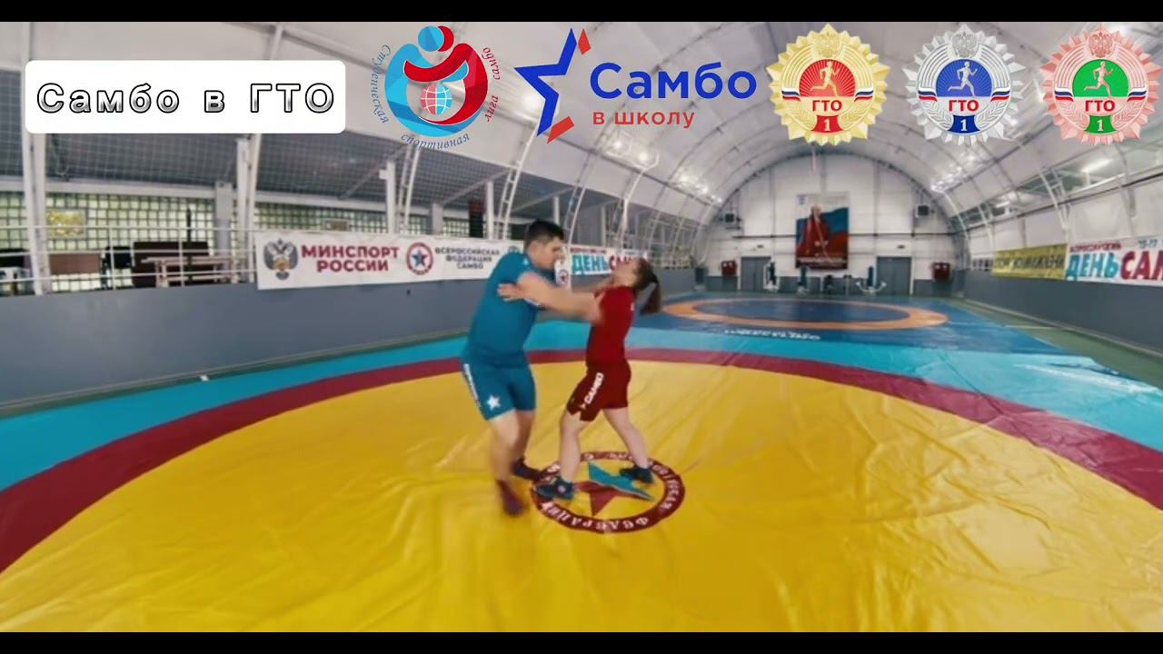 Самозащита. Действия ассистента: выполняет обхват туловища без рук спереди.