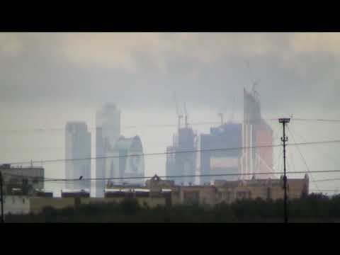 Москва Сити с расстояния 18 км через многократный зум, район Новогиреево, август 2012