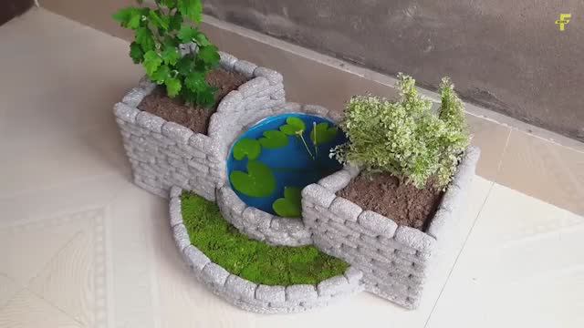 Цветочное кашпо с аквариумом из цемента и пенопласта