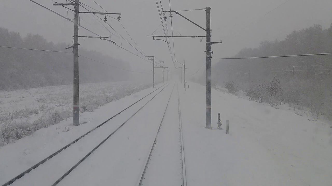 Сильнейший снегопад город Курган. Вид из кабины машиниста.